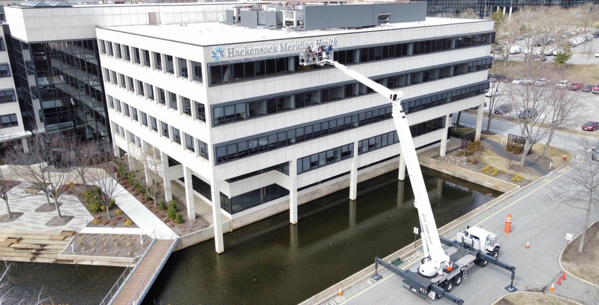 Signage Installation in Hard-to-Reach Spaces with Alpha Platforms Boom ...